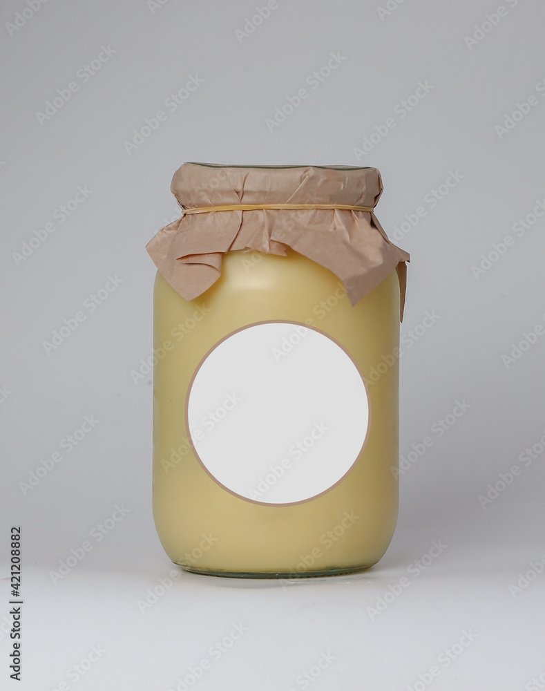 Tablespoon of ghee (clarified butter) on a background. Jar mockup Stock ...
