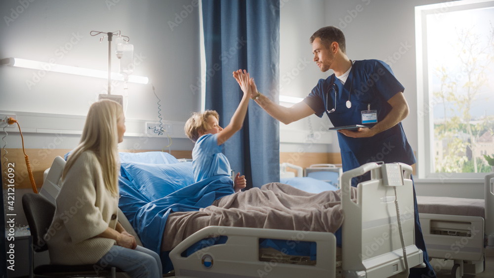 Hospital Ward: Handsome Young Boy Resting in Bed with Caring Mother ...