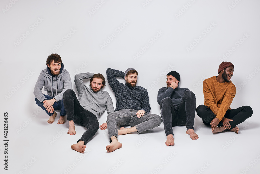 group of young diverse young men isolated on white background, mixed ...