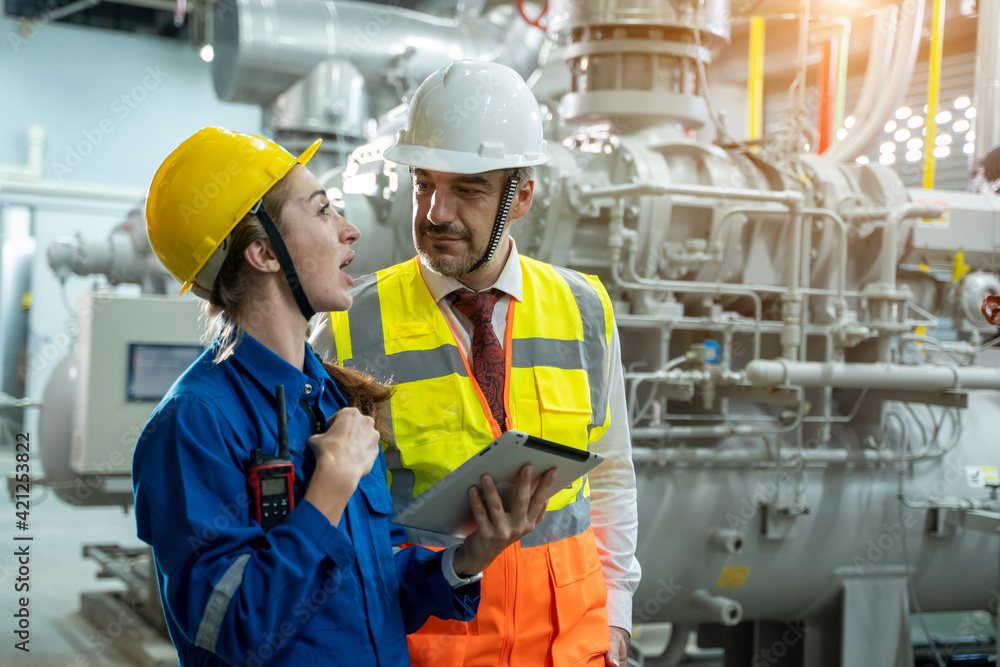 Electrical engineer working in control room of a modern thermal power ...