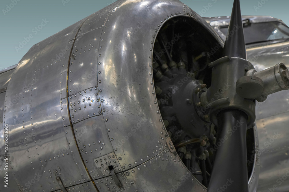 Exterior view of early airliner radial engine, propeller, cowling, and ...