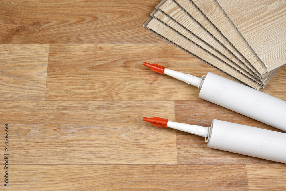 Set of items for PVC ceiling indoor works. Assembly adhesive bottles ...