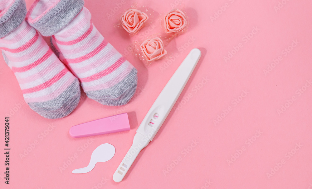 Pregnancy test and socks. Pregnancy test, socks and three decorative ...