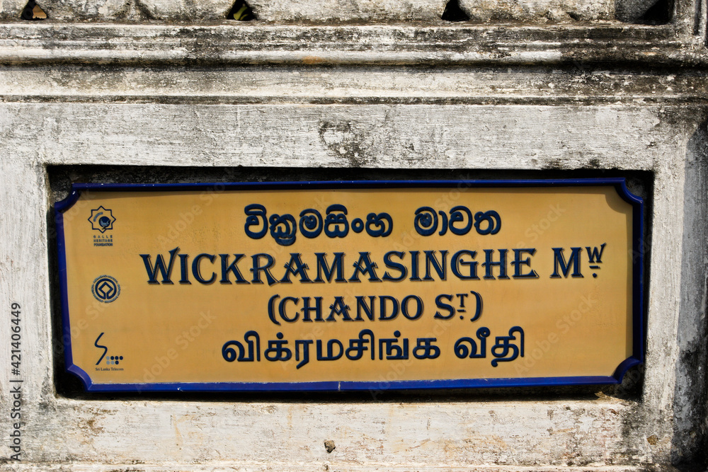 A street sign in English, Sinhalese, and Tamil marks an intersection in ...