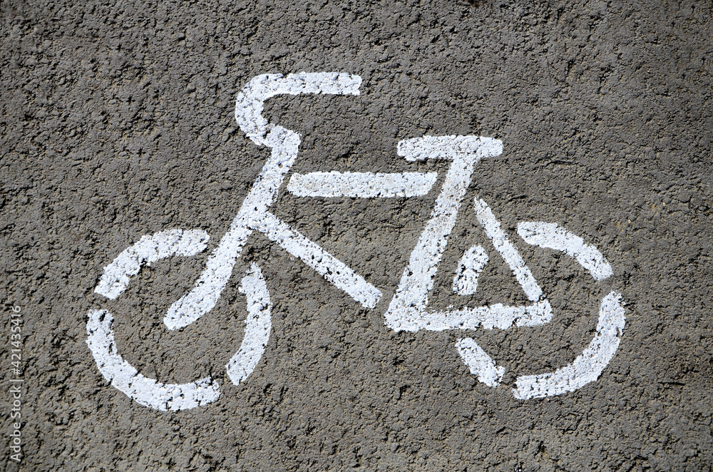 Bicycle path sign drawn in white on the road. Bike lane sign -only ...