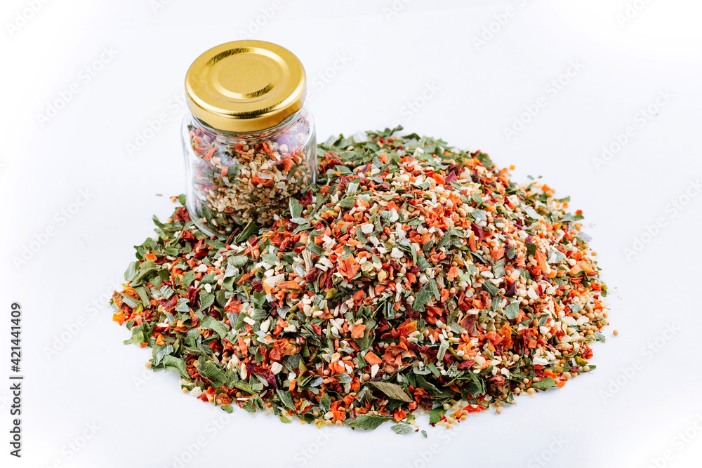 Spices. Seasoning 12 vegetables. A handful of granular condiments with ...