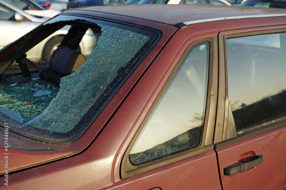 Broken rear window in car, thief smashed window and stole valuable ...