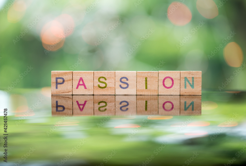 Words concept, PASSION word cube on reflection floor bokeh blur ...