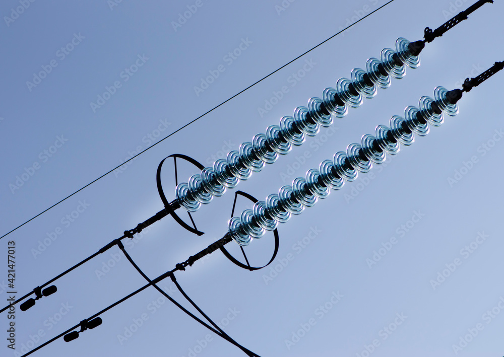 power line of cables and insulators close up. electrical insulators ...