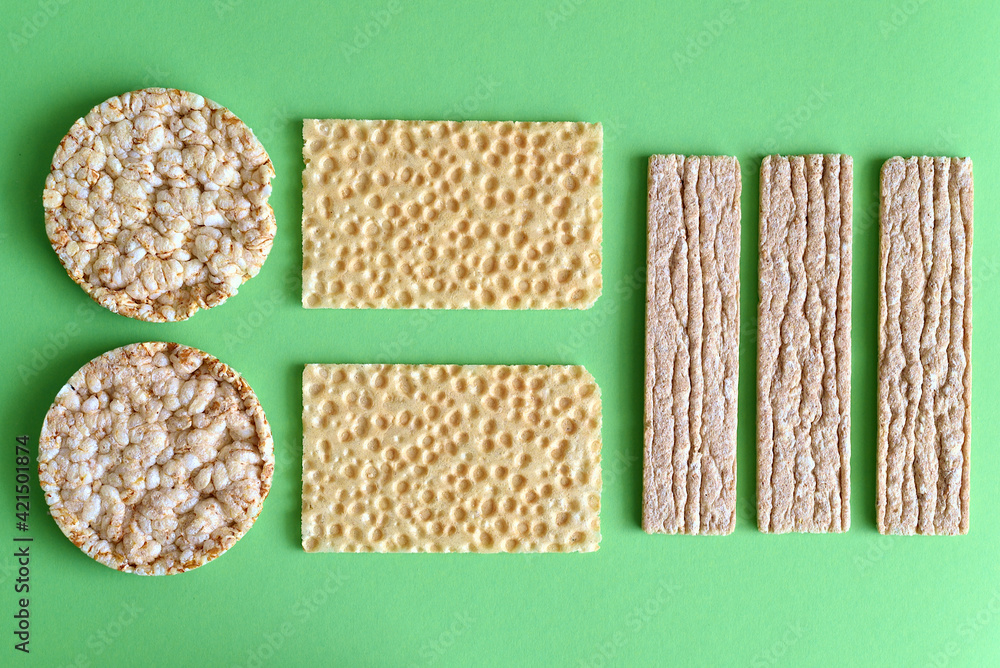 Types of diet whole grain crisps on a green background Stock Photo ...