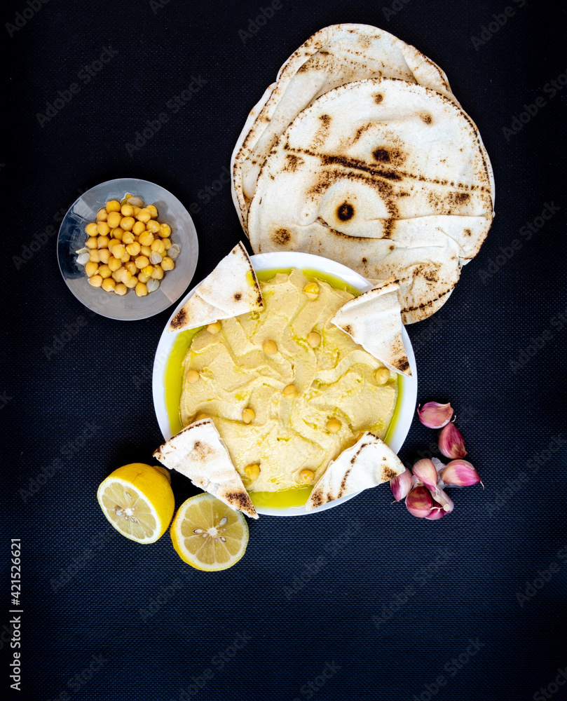 Top view hummus with dark background. Arab food, chickpeas, extra ...