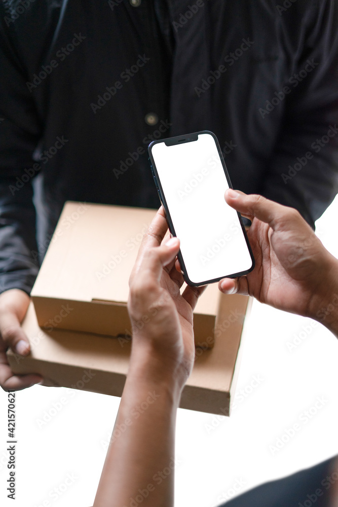 cashless payment gesture. a man holding a phone is transacting using a ...
