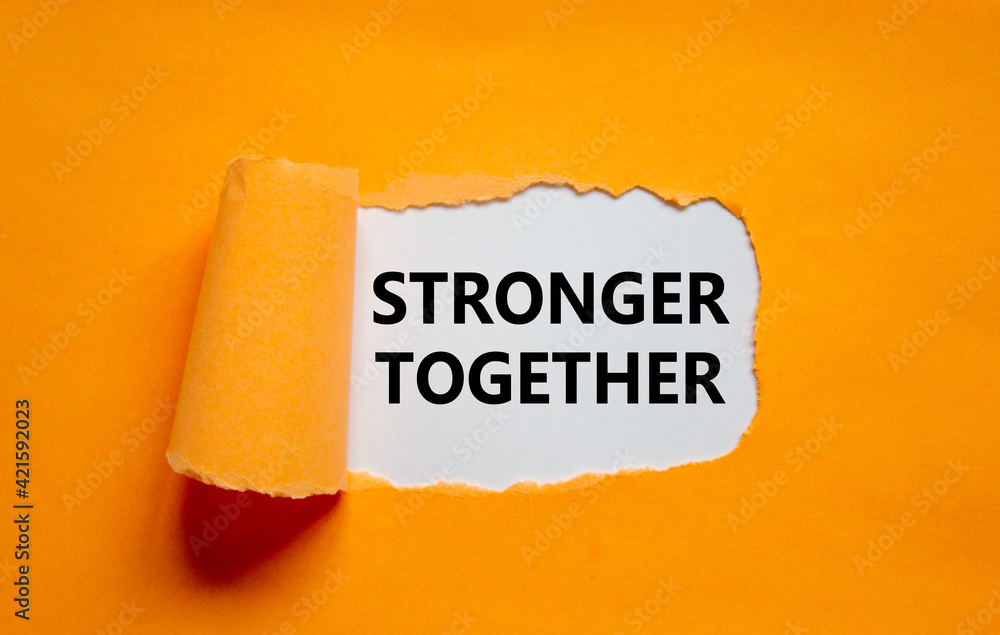 Stronger together symbol. Words Stronger together appearing behind torn ...