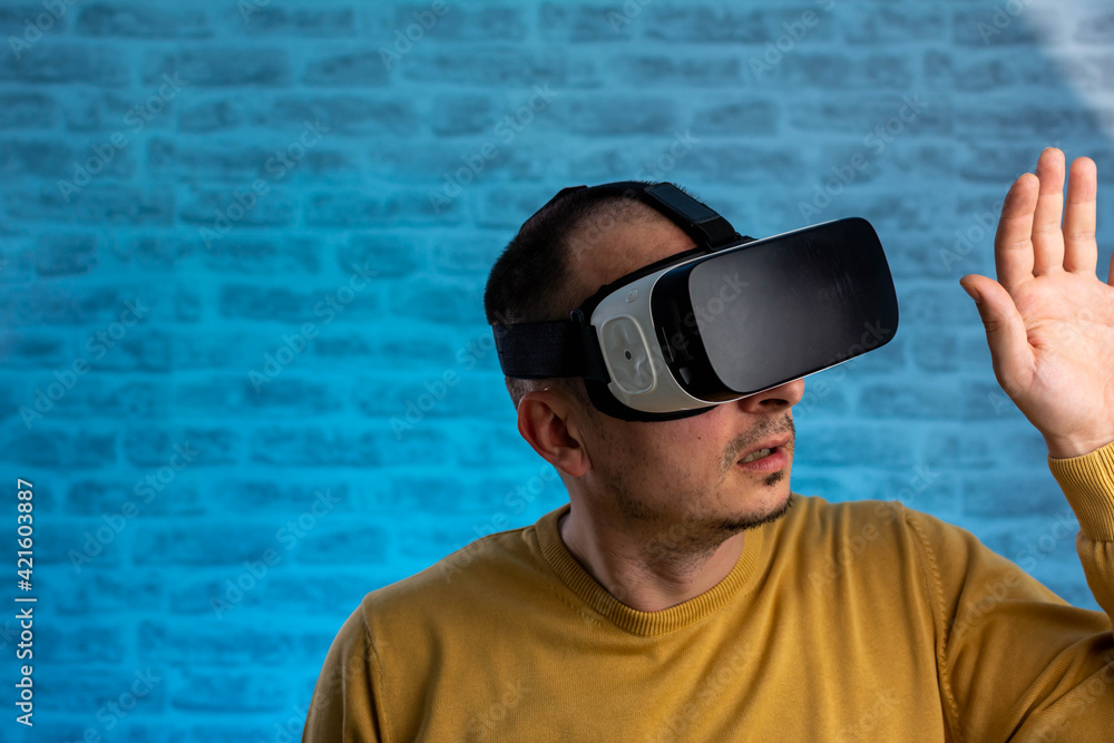 Middle aged man using virtual reality headset. VR, future, gadgets ...