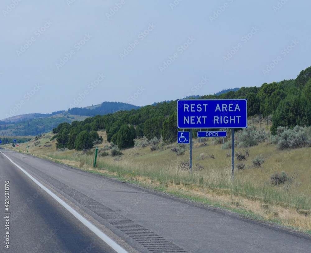 Roadside sign with directions to a rest area along the road in Utah ...
