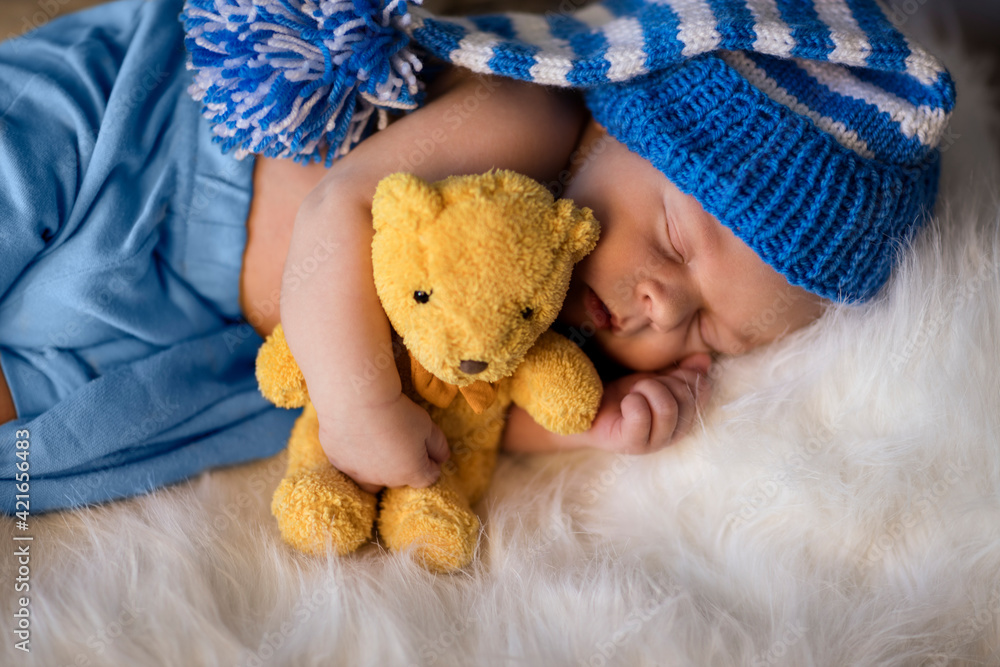 Serenity little newborn boy hugging teddy bear Stock Photo | Adobe Stock