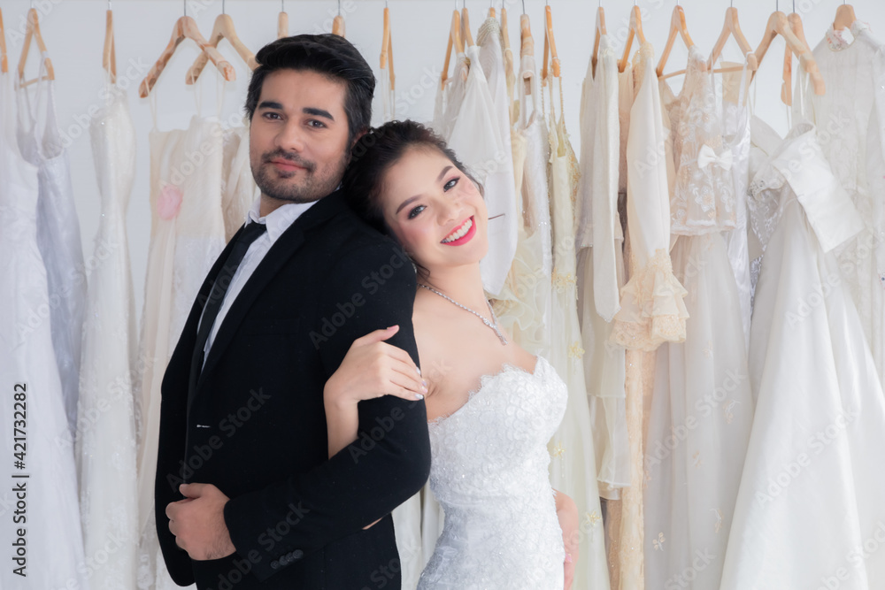 Happy mix race wedding and shopping concept, couple hold hand together ...