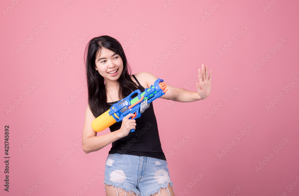 Portrait cheerful young asian woman holding plastic water gun Smiling ...