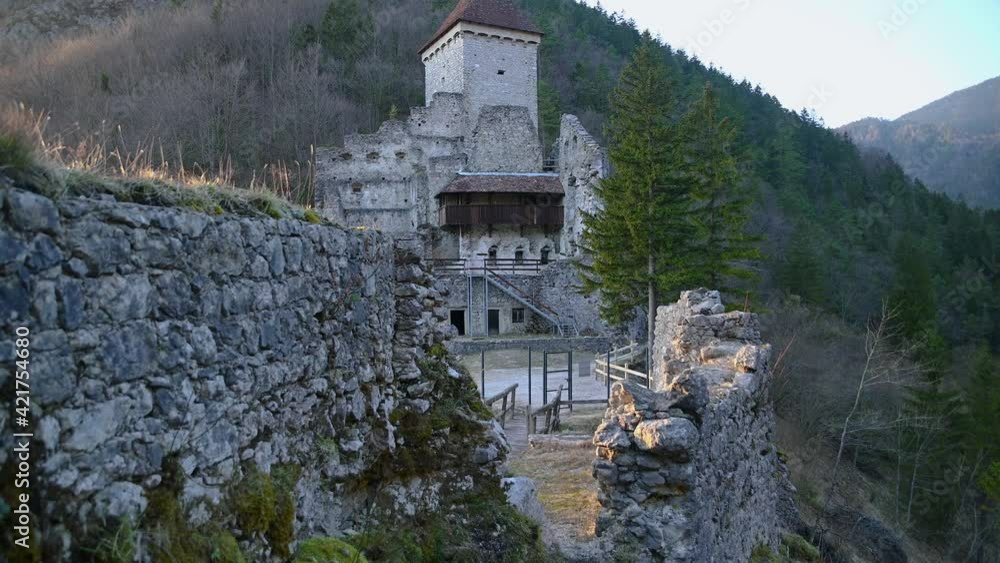 Decayed and collapsed defense thick walls in the foreground. Medieval ...