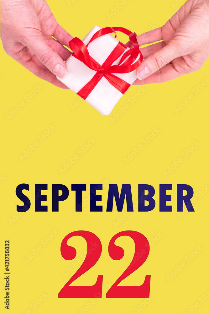 September 22nd. Festive Vertical Calendar With Hands Holding White Gift ...