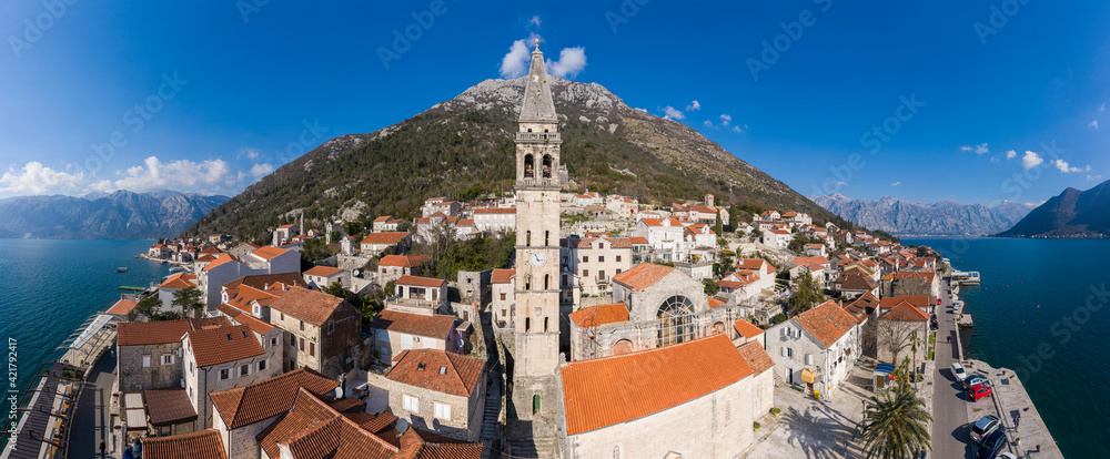 Aerial panorama 180° of the old coastal town of Perast at the foot of ...