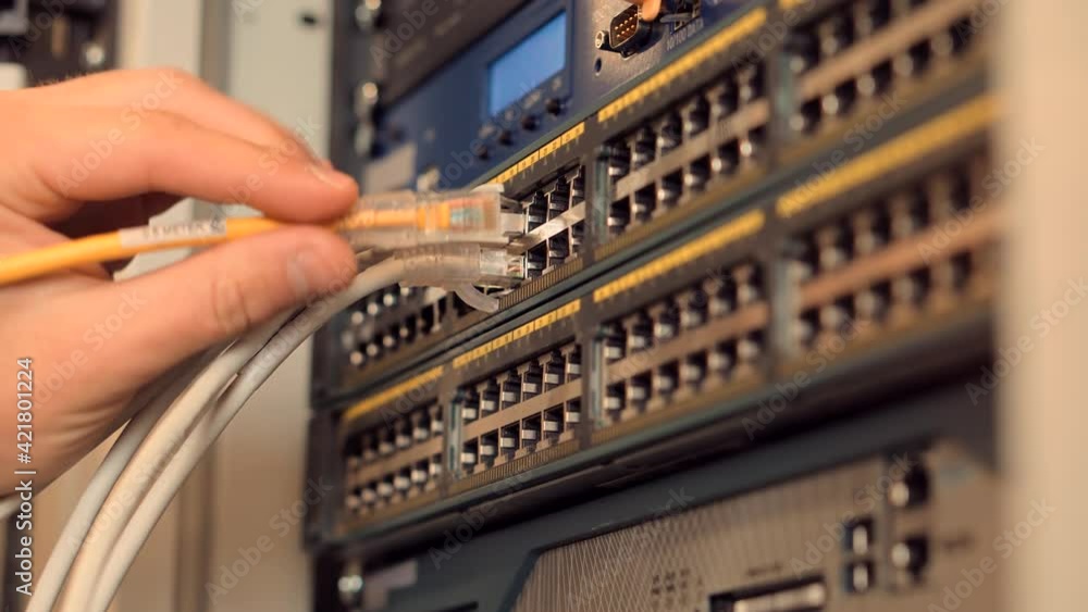 IT Engineer Patching Network Equipment In Server Room.Network Engineer ...