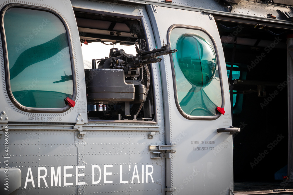 Machine gun in a side window of the Airbus Helicopters H225M helicopter ...