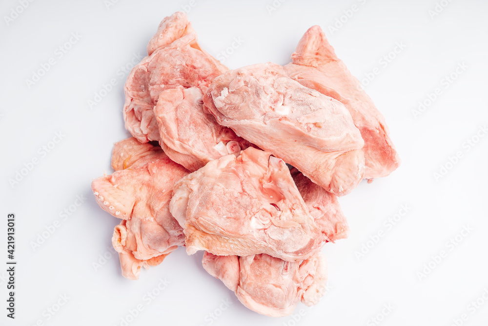 Raw chicken meat. Chicken offal, bones, backs on a white background ...