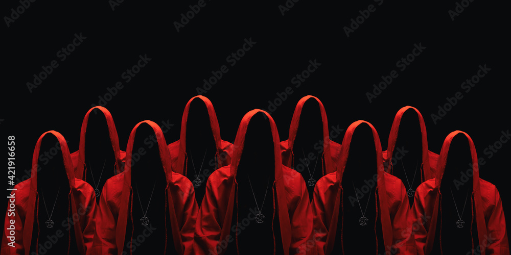 Group of mystery people in a red hooded cloaks. Isolated on black. Unrecognizable person. Hiding ...