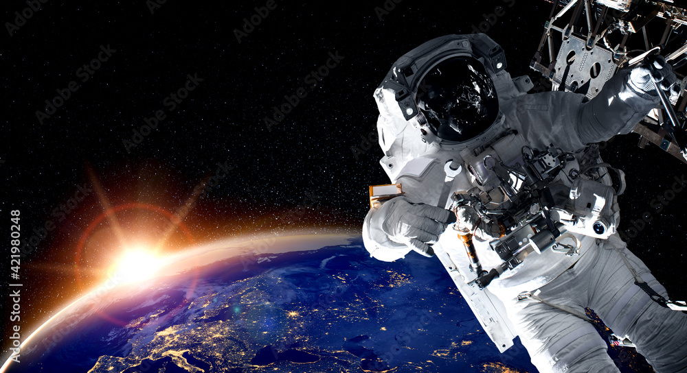 Astronaut spaceman do spacewalk while working for space station in ...