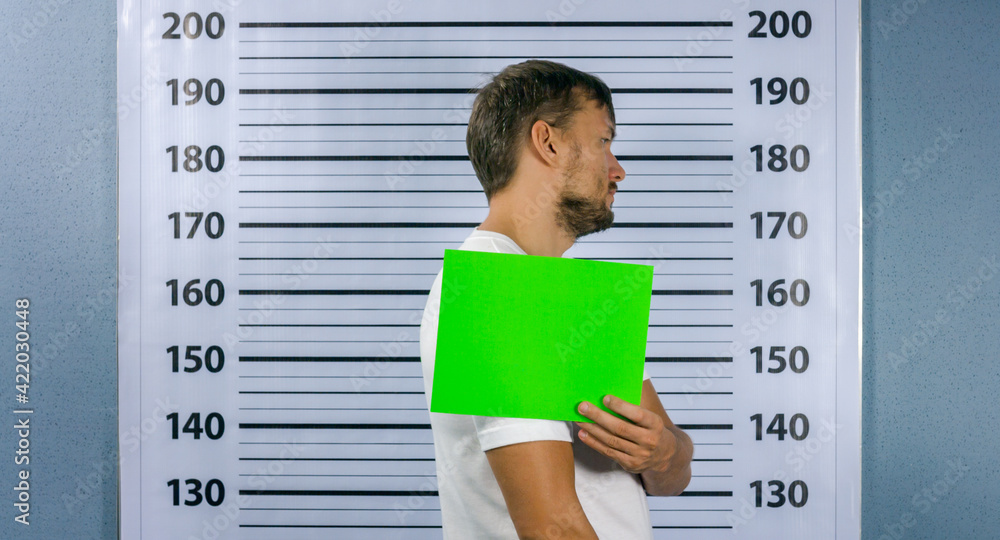 Closeup mugshot photo of man holding green screen blank sign in hands ...