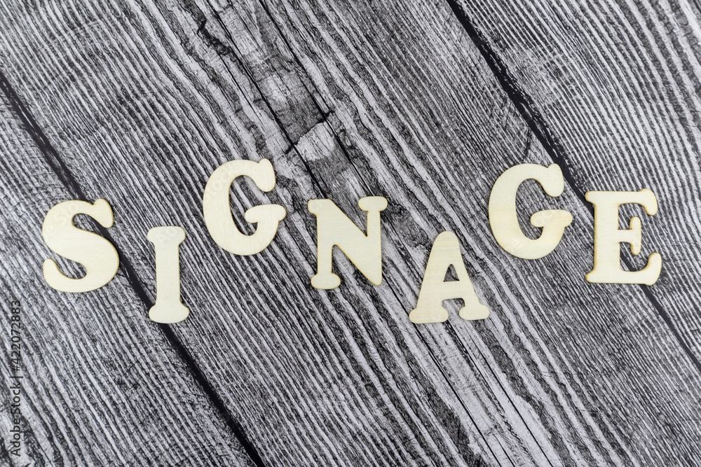 Signage concept with design template on old diagonal wooden boards and ...