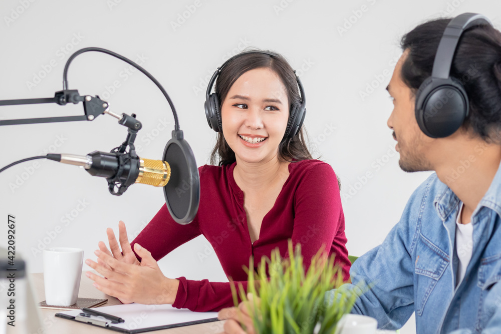 Smile two asian young woman, man radio hosts in headphones, microphone ...
