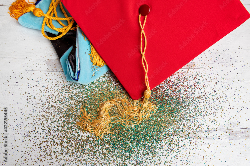 Red Graduation Cap With Gold Tassel Stock Photo | Adobe Stock