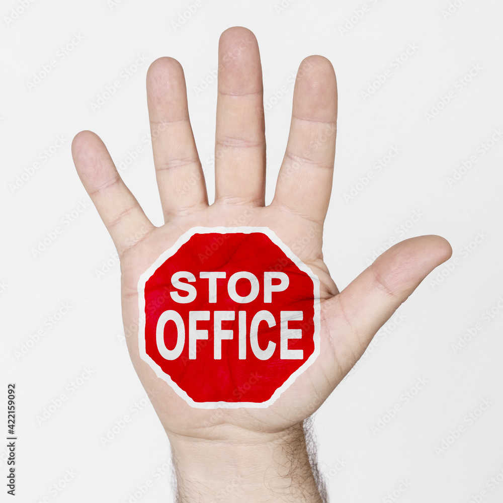 On the palm of the hand there is a stop sign with the inscription ...