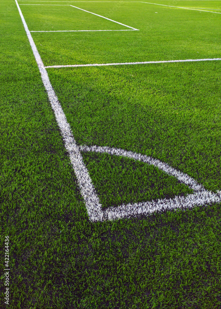 Artificial grass soccer field. Corner kick line of ball and a soccer ...