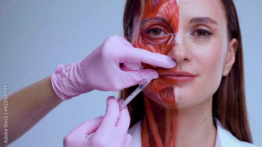 Botox injection in the face. Young woman with half of face with muscles ...