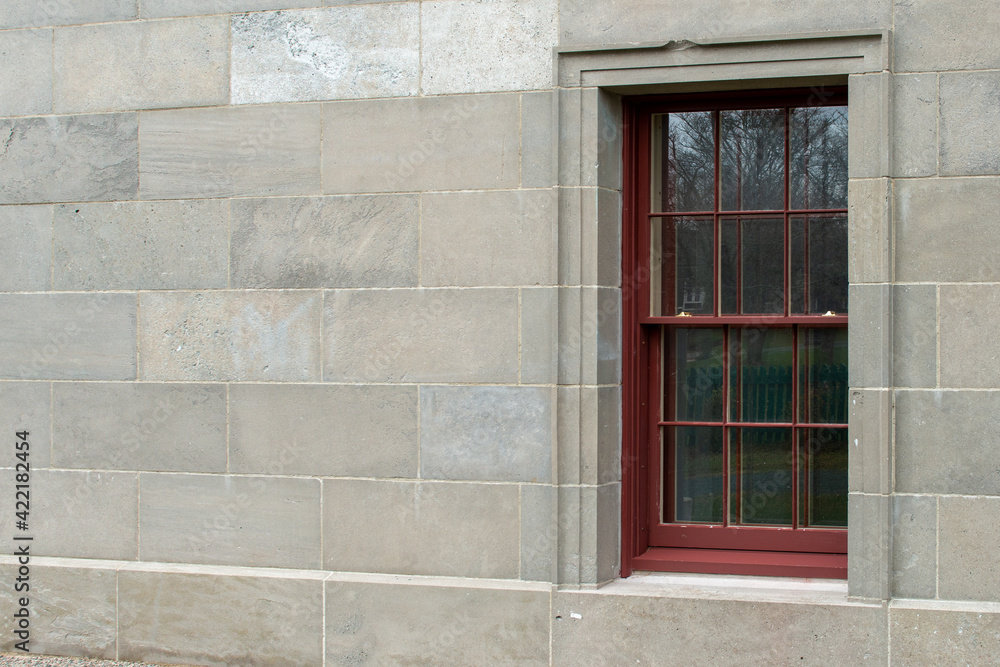 Side view of a large historic building from the grass covered ground ...