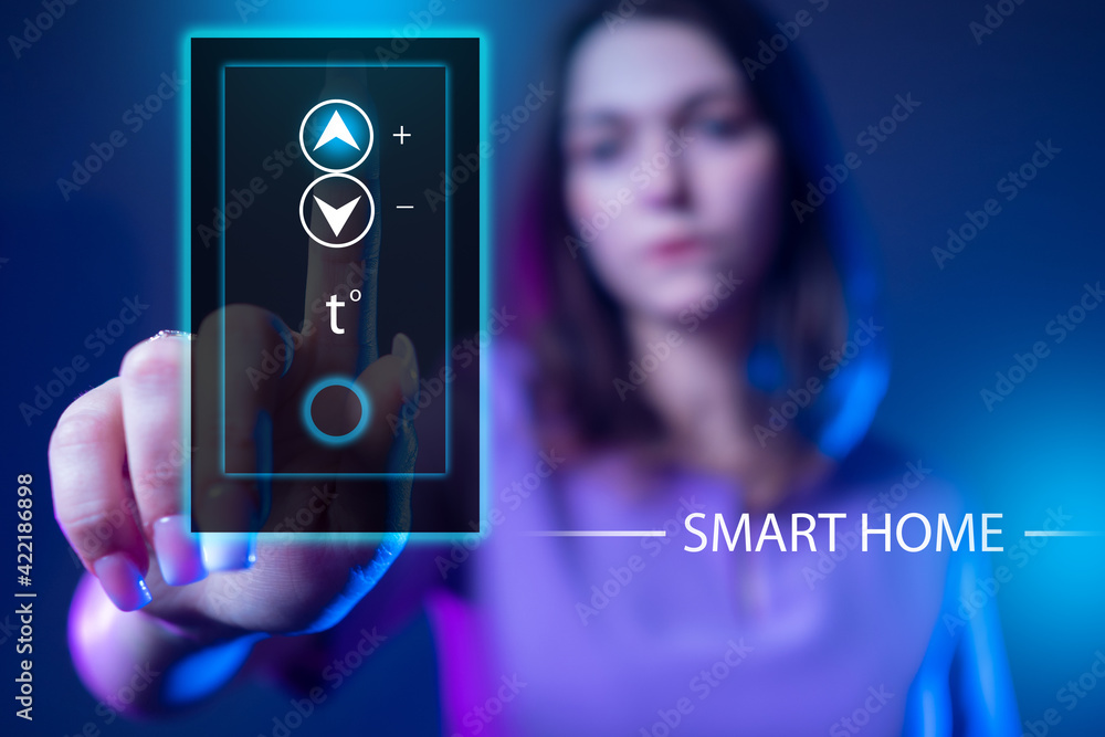 Woman controls temperature in house concept. House is equipped with a ...
