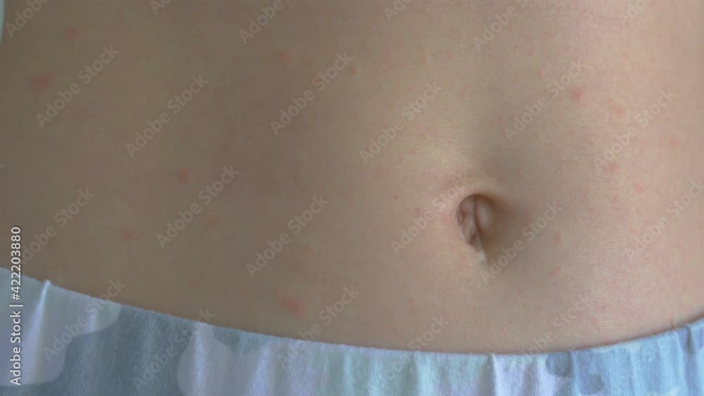 Close-up in the area of the abdomen and lateral body slowly turning ...