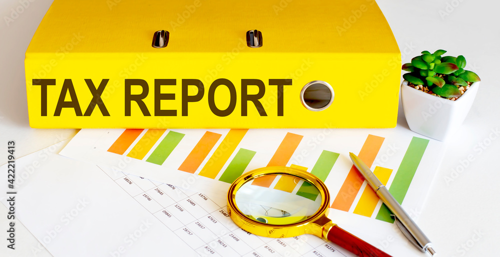 office folder with text TAX REPORT with charts, magnifier and pen Stock ...