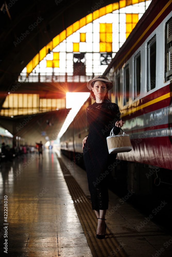 LGBT Transgender model travels on train at station railway Stock Photo ...