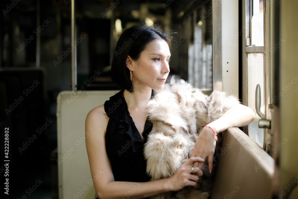LGBT Transgender model travels on train at station railway Stock Photo ...
