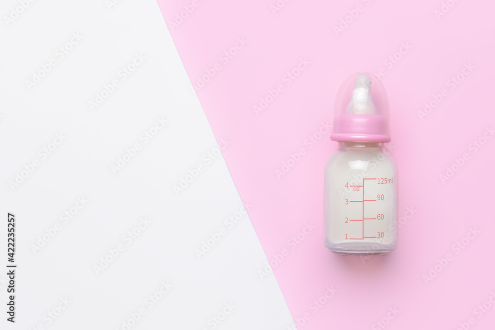 Bottle of milk for baby on color background Stock Photo | Adobe Stock
