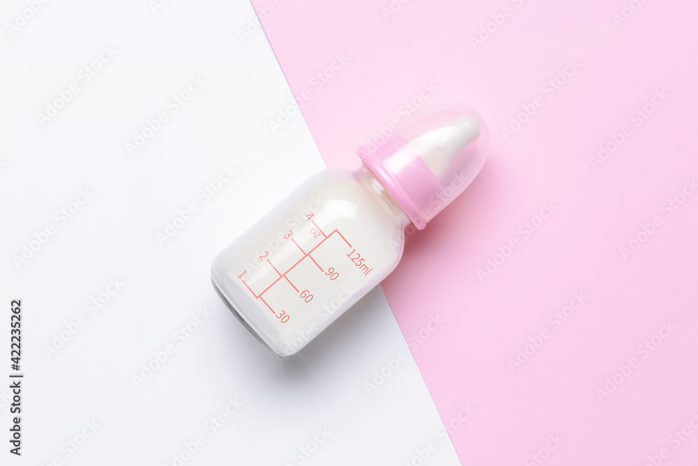 Bottle of milk for baby on color background Stock Photo | Adobe Stock