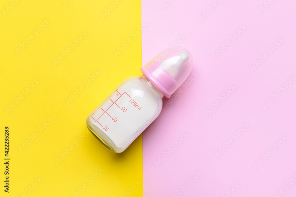 Bottle of milk for baby on color background Stock Photo | Adobe Stock