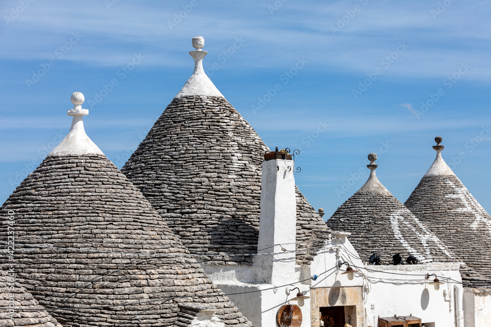 Stone roofs of Trulli Houses in Alberobello; Italy. The style of ...