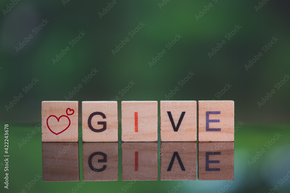 Encourage Words concept, GIVE word cube on bokeh blur background ...