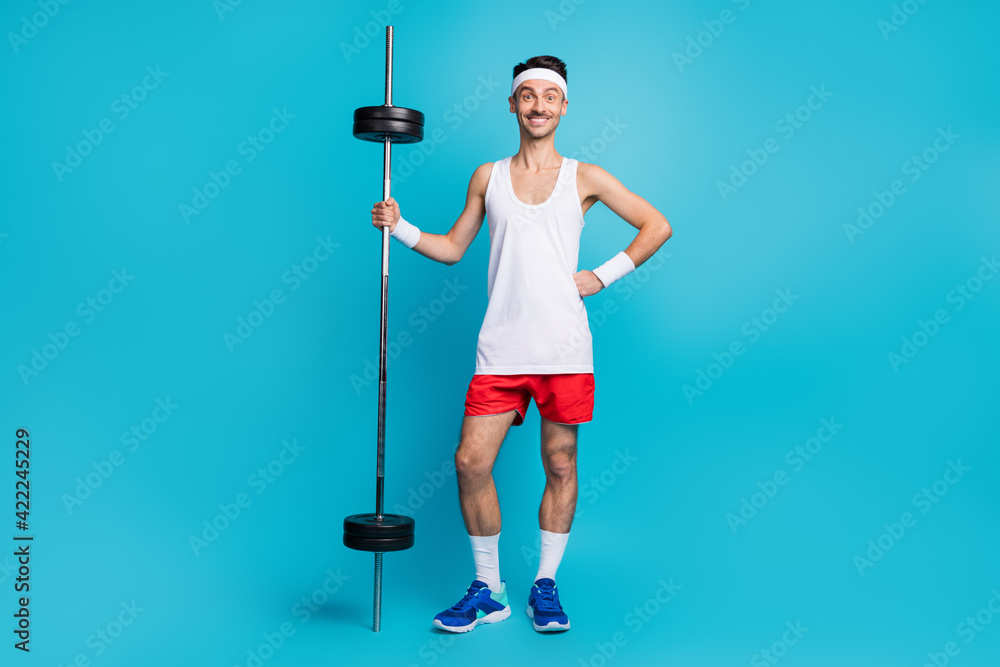 Full length photo of young skinny man happy positive proud exercise ...