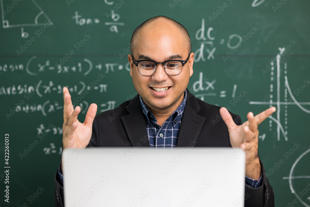 Indian young teacher man sitting teaching online video conference live ...